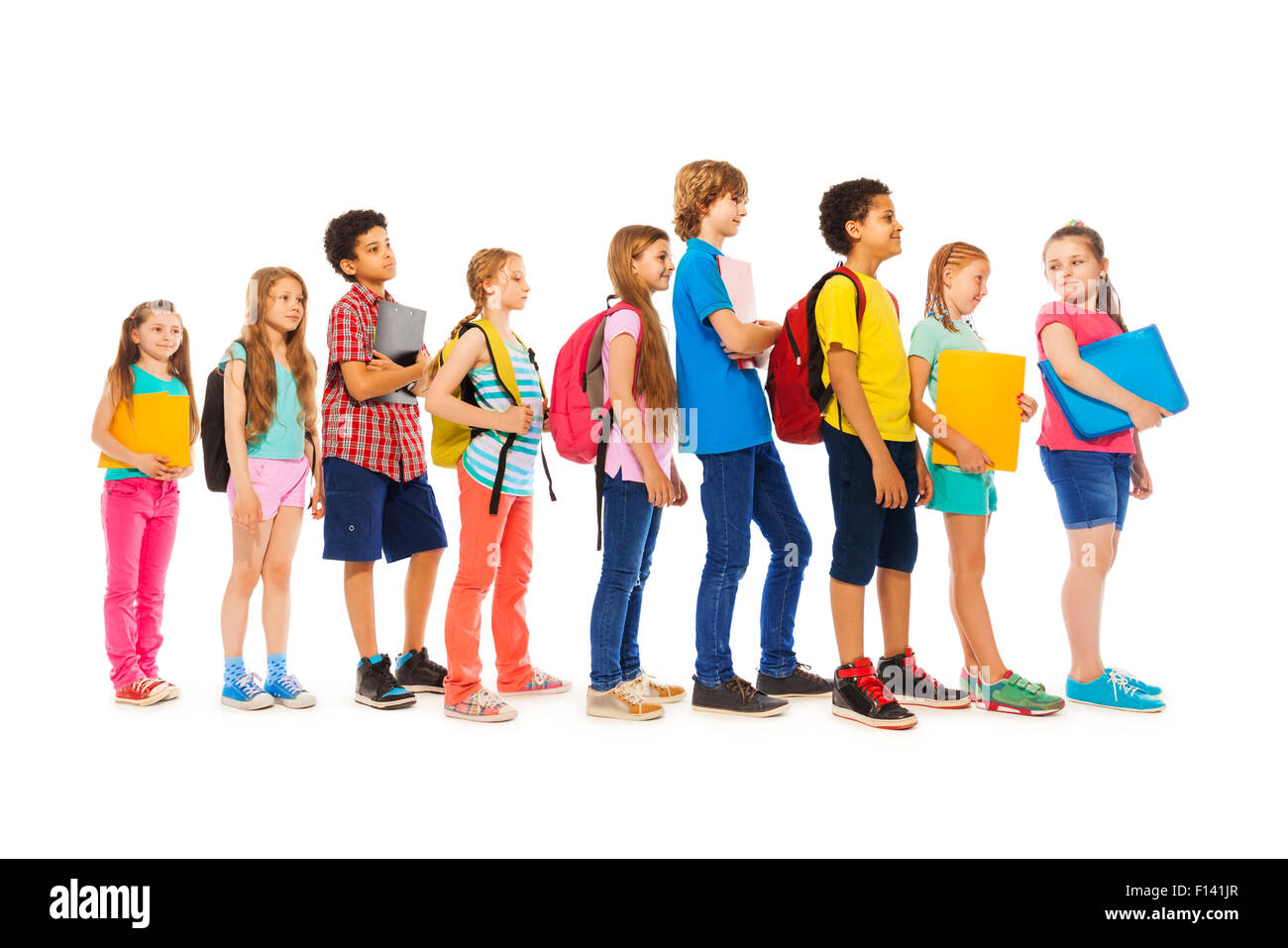 Group of kids in a line side view Stock Photo - Alamy