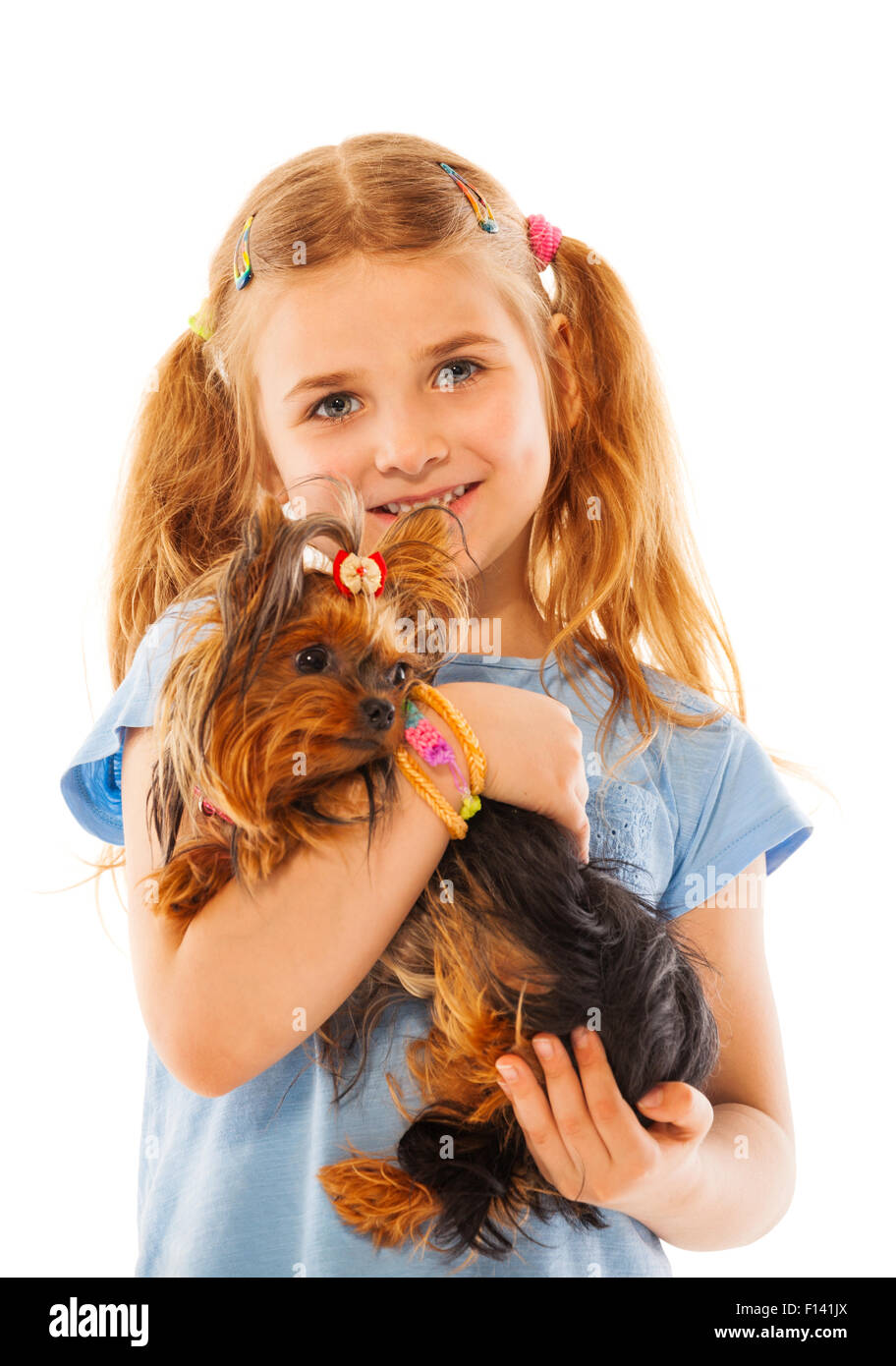 Little girl smile and hold cute small dog Stock Photo - Alamy