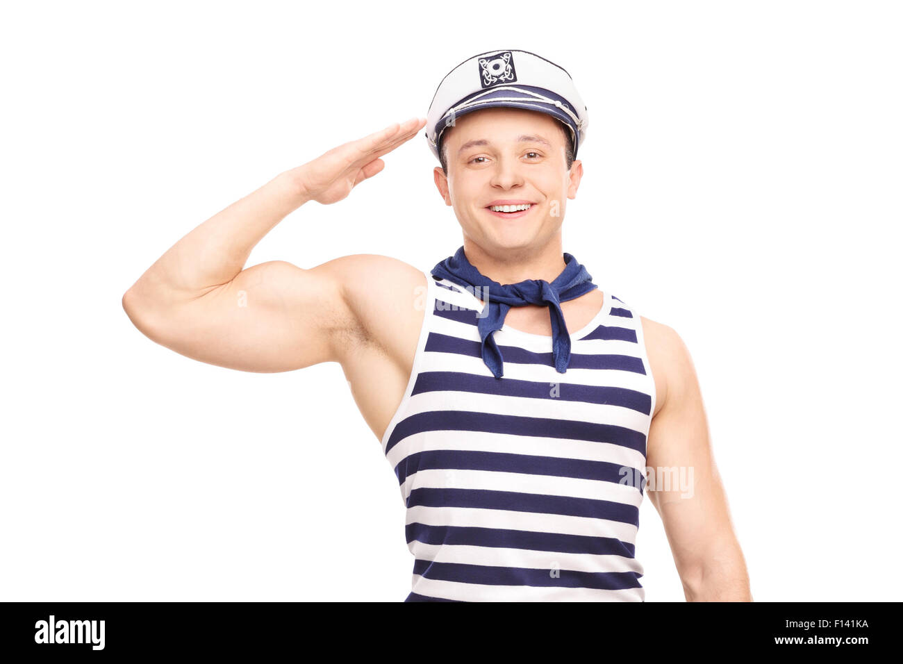 Young male sailor saluting towards the camera isolated on white ...