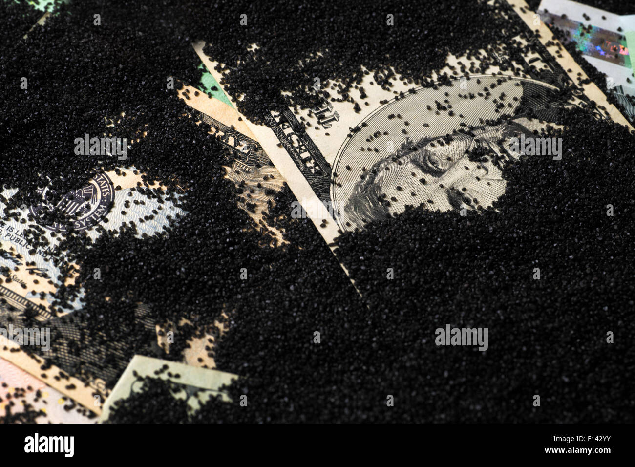 Banknotes in black sand conceptual hi-res stock photography and images ...