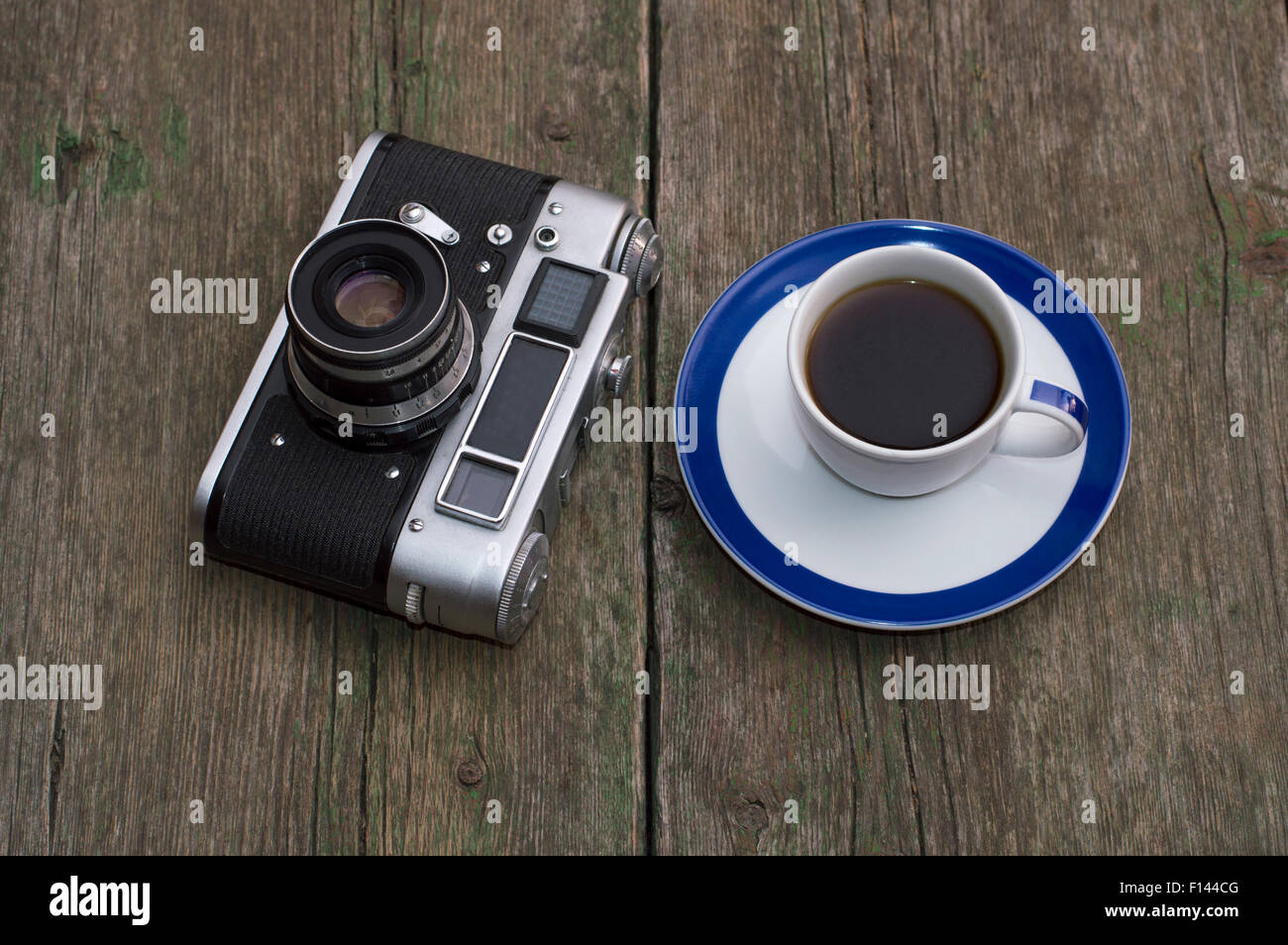 retro the camera and a cup of black coffee on a table Stock Photo - Alamy