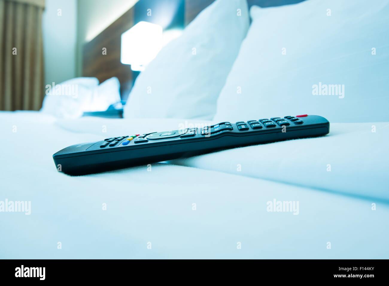 TV Remote Control in Hotel Room. Remote on the Hotel Bed Closeup Stock ...