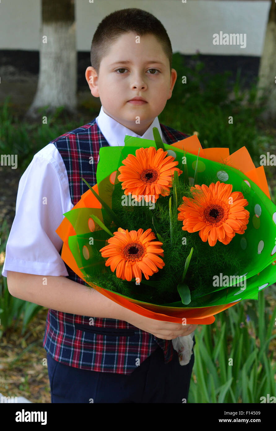 the school student with a bouquet of bright flowers near school Stock ...