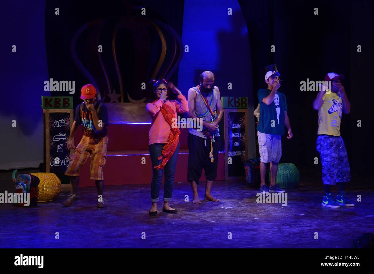 Pakistani artists performing on the stage during a drama titled ‘Kaun ...