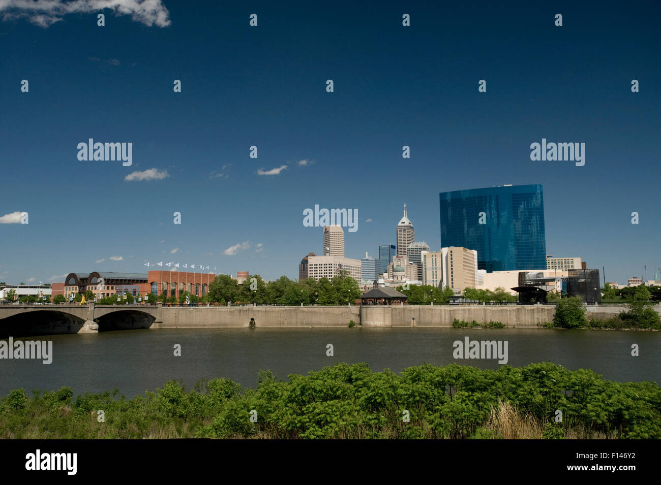Indianapolis skyline and White River Trail bridge over White River ...