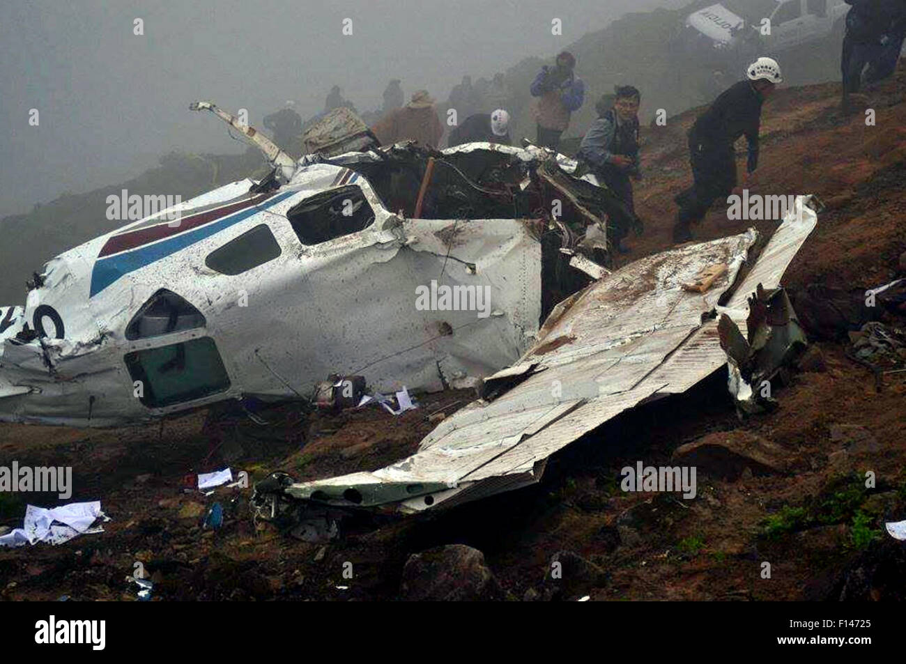 Lima, Peru. 26th Aug, 2015. Rescuers work at the site of a plane crash ...