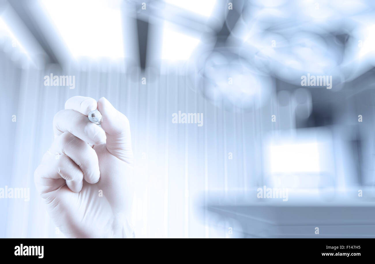 doctor hand drawing with modern computer interface as medical concept ...