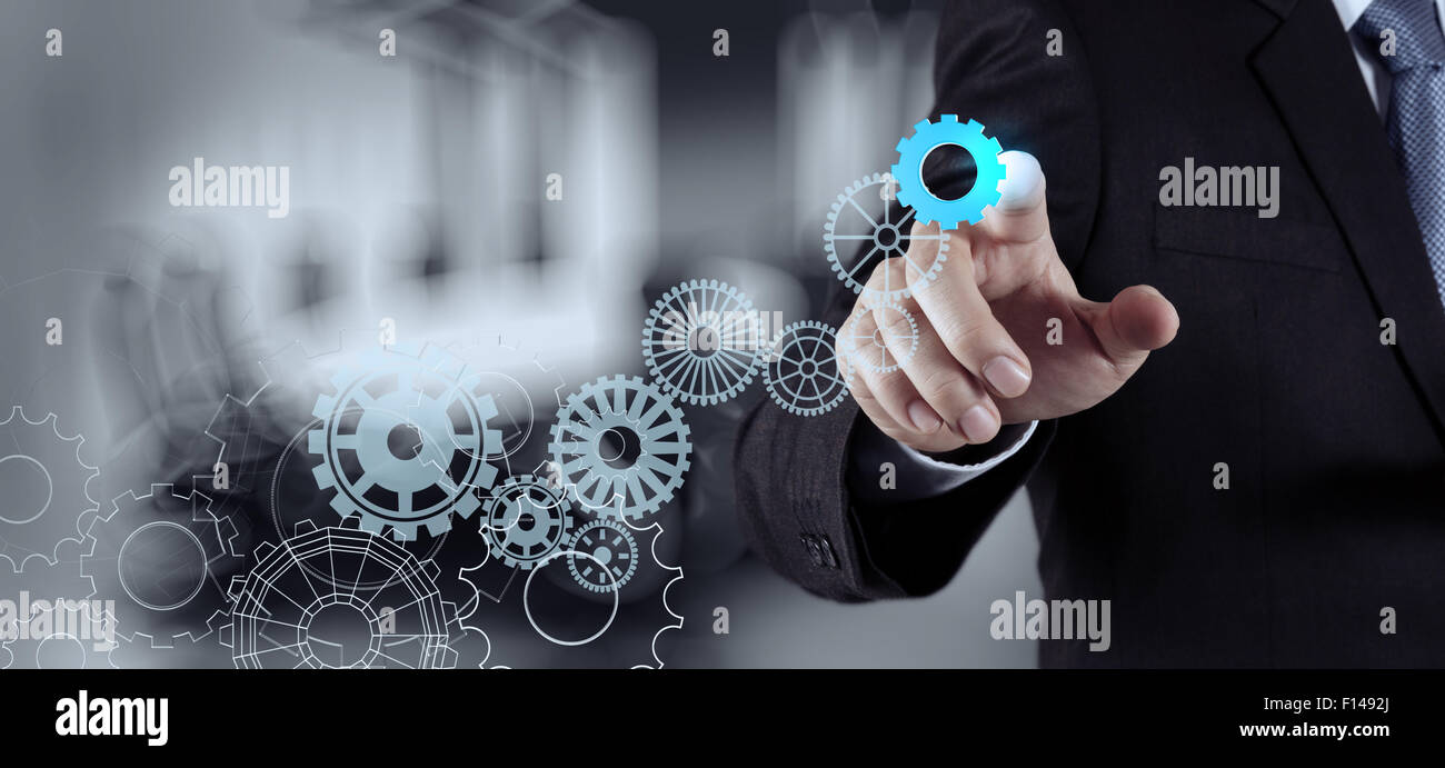 businessman hand draws gear to success concept Stock Photo - Alamy