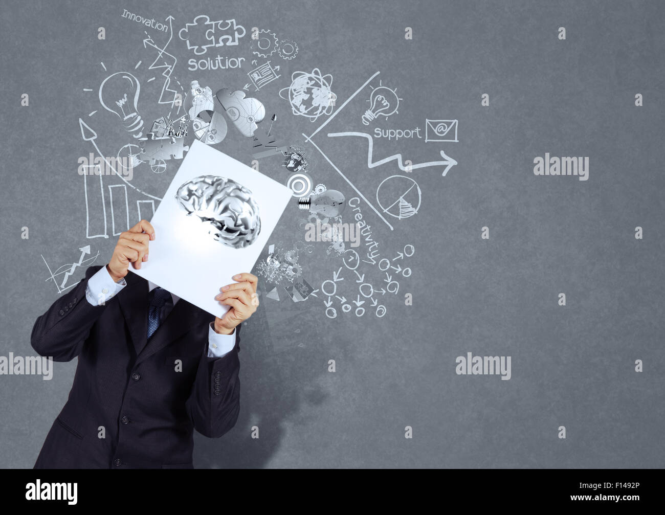 businessman hand show book of 3d metal brain as concept Stock Photo - Alamy