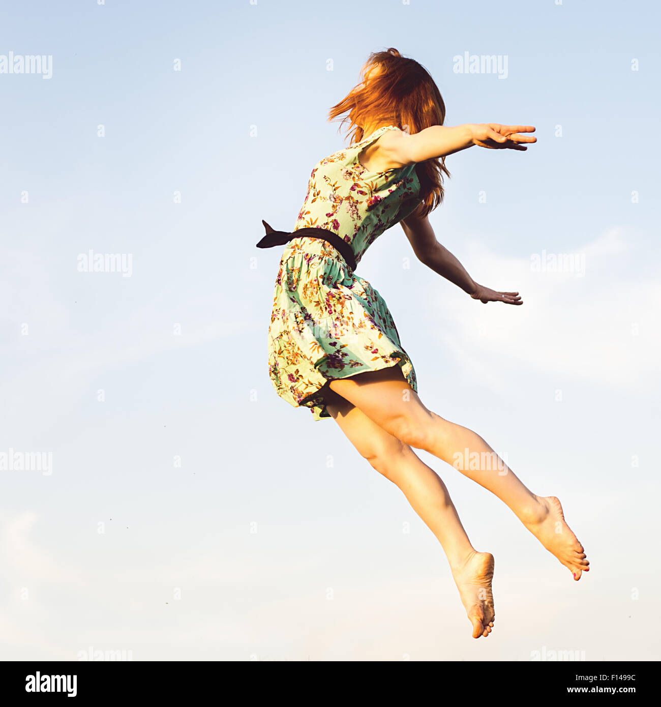 Happy Young Woman Jumping Stock Photo - Alamy