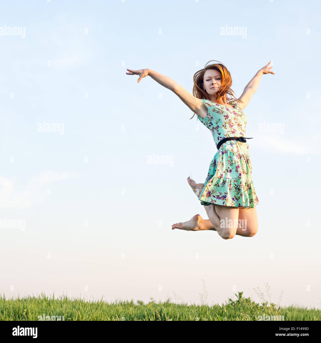Happy Young Woman Jumping Stock Photo - Alamy