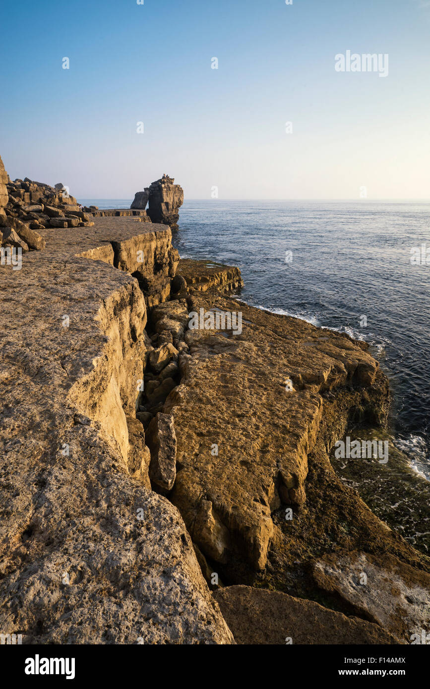 Rocky cliff landscape with sunset over ocean Stock Photo - Alamy