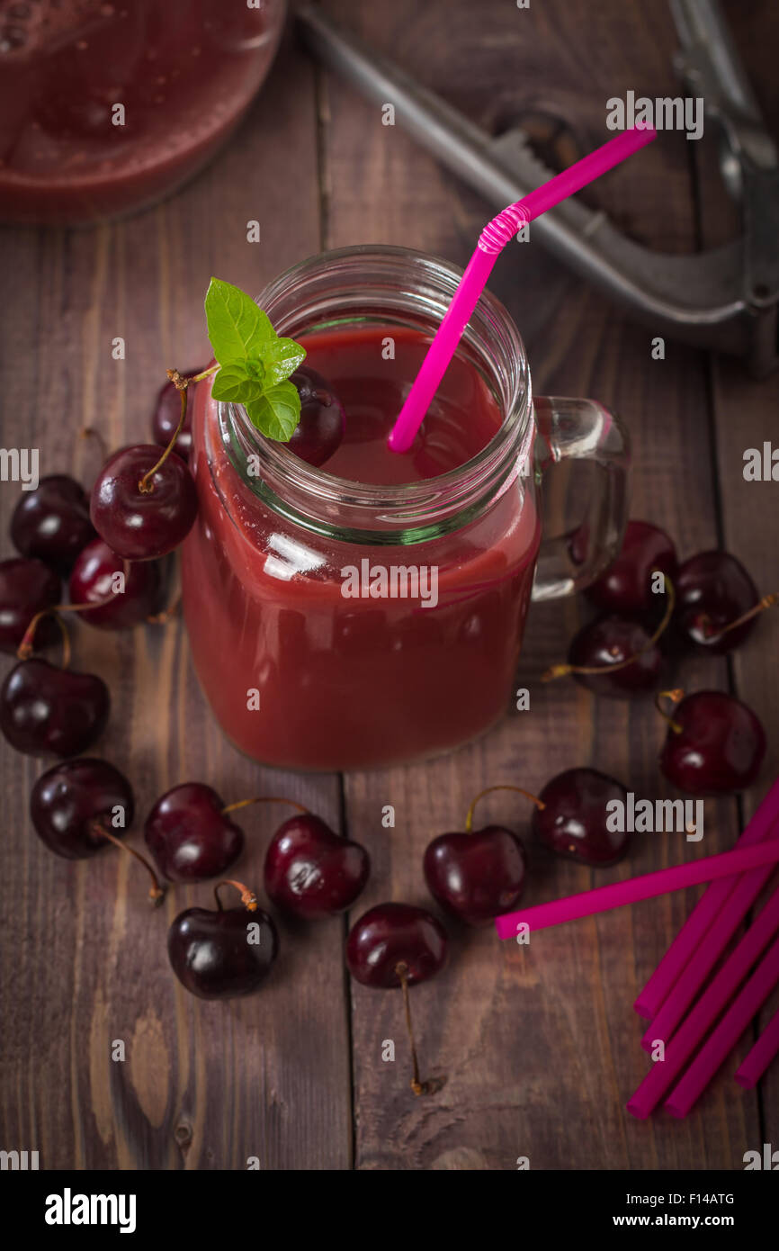 homemade cherries drink with fresh cherry on wooden table Stock Photo ...