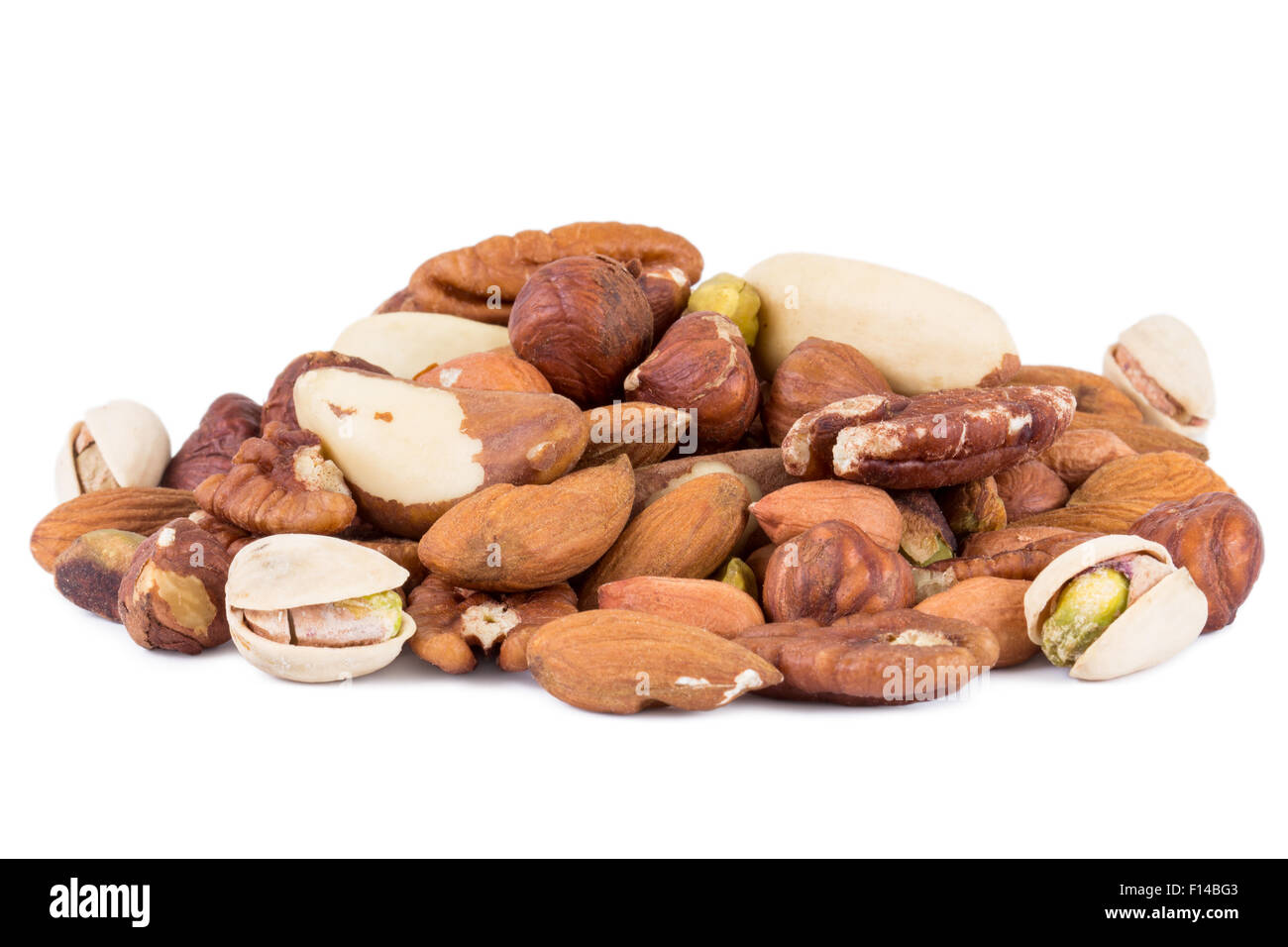 Close-up of mixture of several different peanuts, isolated on white ...
