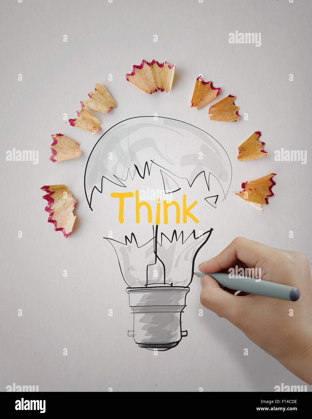 hand drawn light bulb word design THINK with pencil saw dust on paper ...