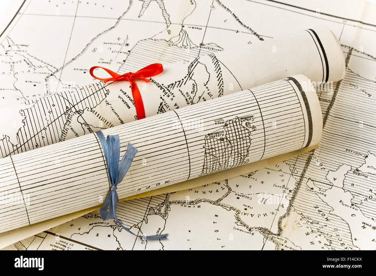 Old Maps in rolls with colorful ribbons Stock Photo - Alamy