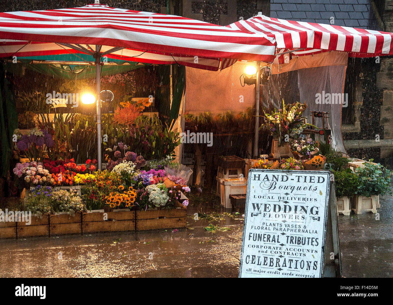 A street flower stall in the rain Stock Photo - Alamy