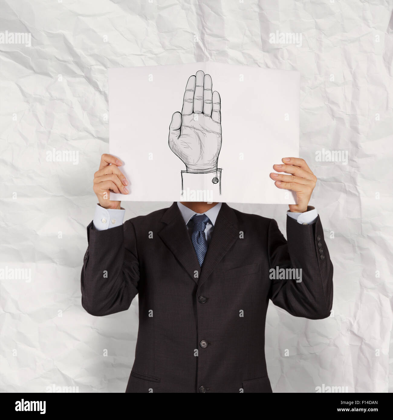 businessman show book of Hand raised and crumpled paper background as ...