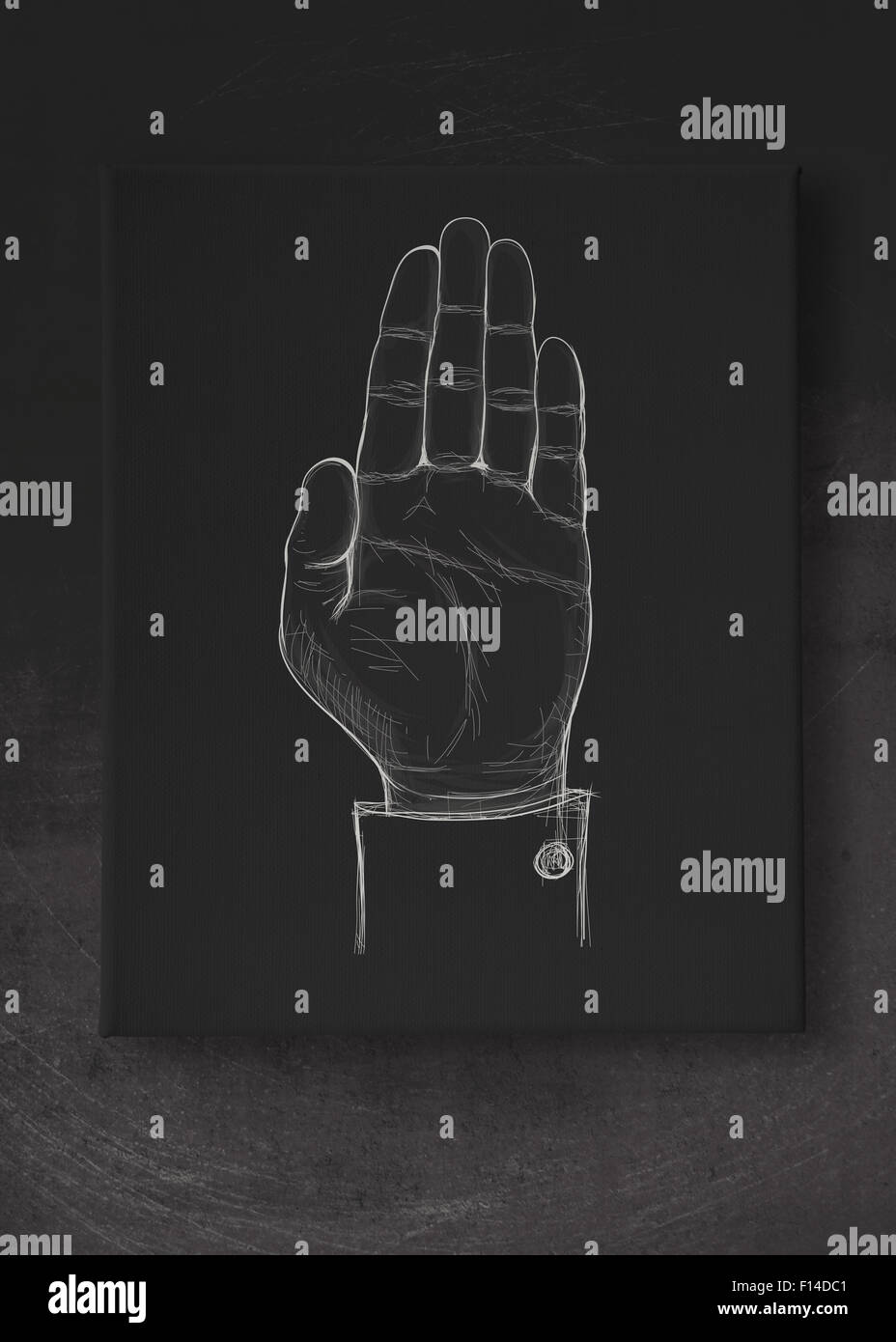 Hand raised draw sign on dark canvas board as concept Stock Photo - Alamy