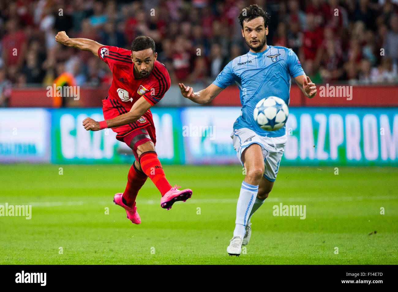Leverkusen, Germany. 26th Aug, 2015. Leverkusen's Karim Bellarabi (l ...