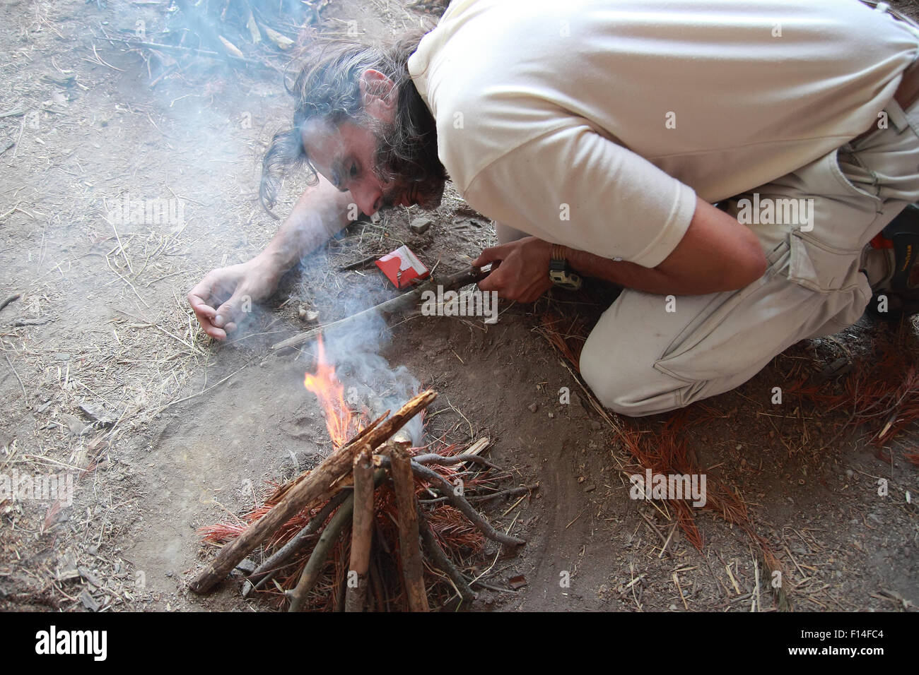 Lighting a fire hi-res stock photography and images - Alamy