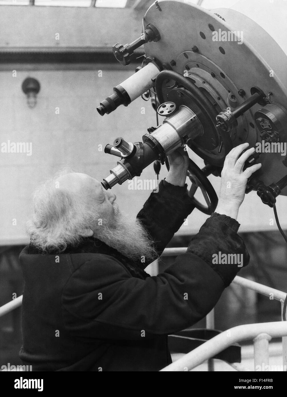 Astronomer Looking Through Telescope