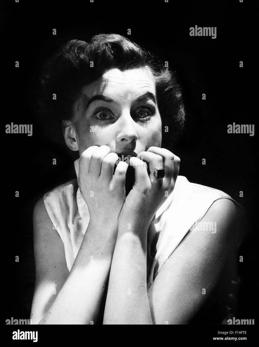 1950s SCARED FRIGHTENED BRUNETTE WOMAN ABOUT TO SCREAM IN FEAR Stock ...