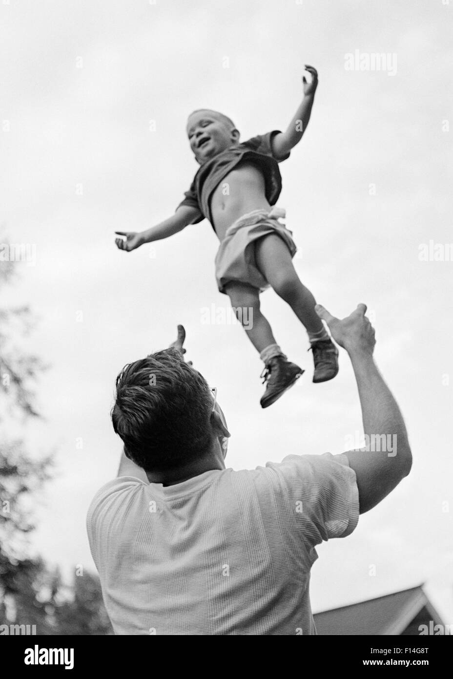 Father with boys Black and White Stock Photos & Images - Alamy