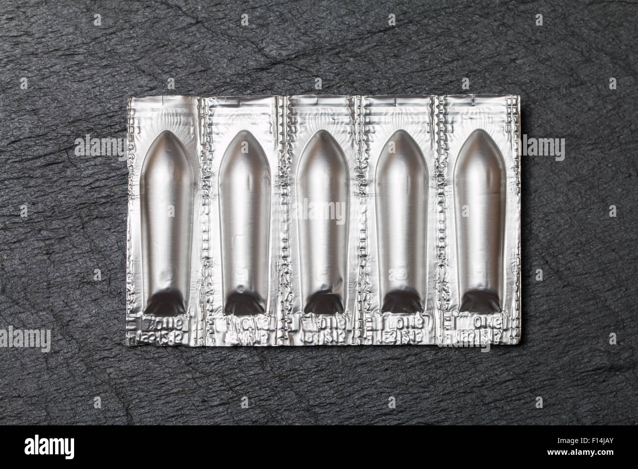 Silver package suppository on black hi-res stock photography and images ...