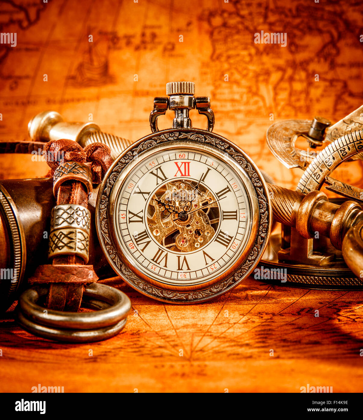 Vintage Antique pocket watch on an ancient world map in 1565 Stock ...