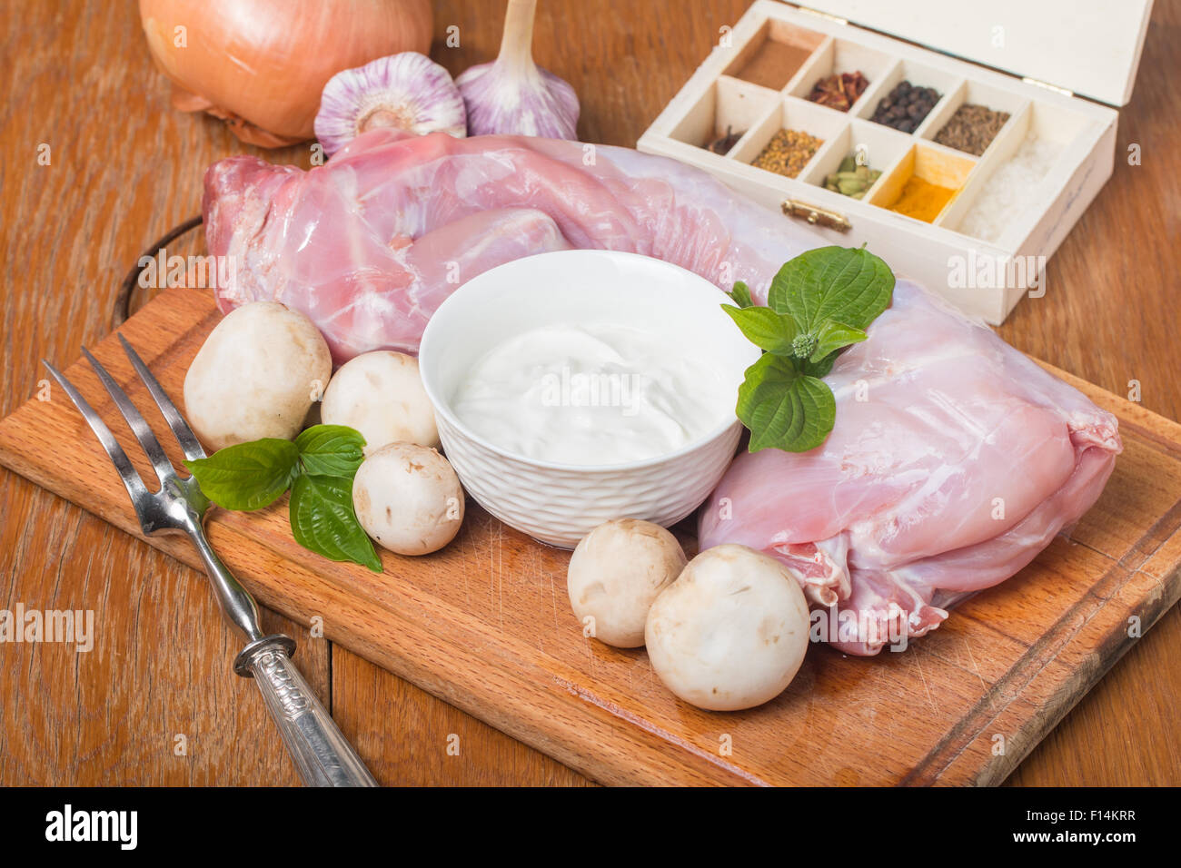 Rabbit carcass, garlic, onion, sour cream, mushrooms and spices on ...