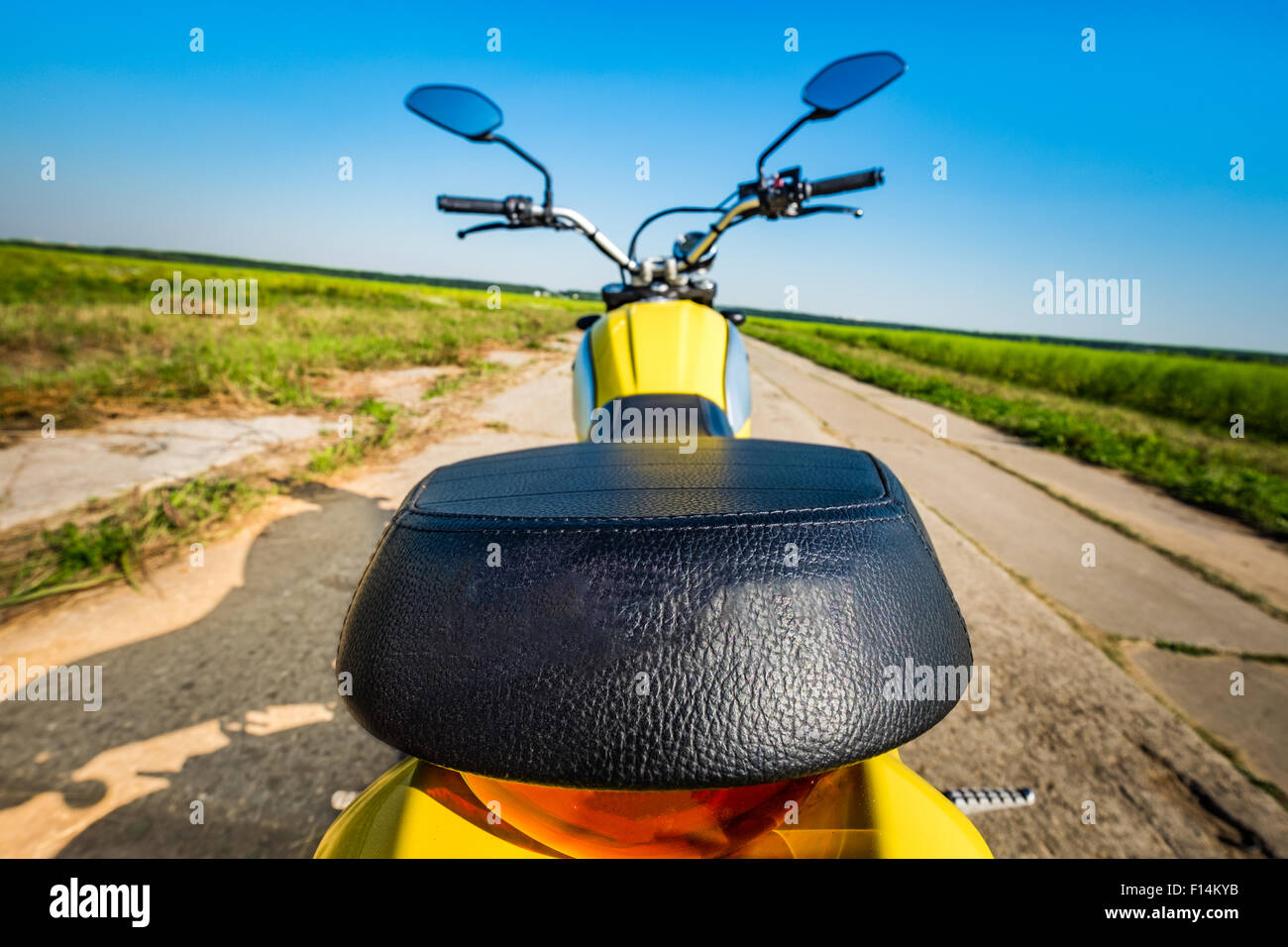 Motorcycle on the road back view Stock Photo - Alamy