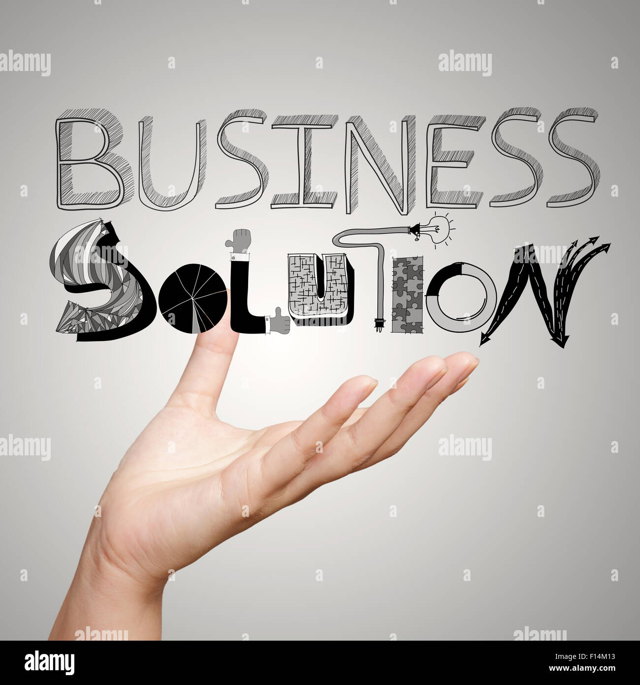 hand showing design word BUSINESS SOLUTION as concept Stock Photo - Alamy
