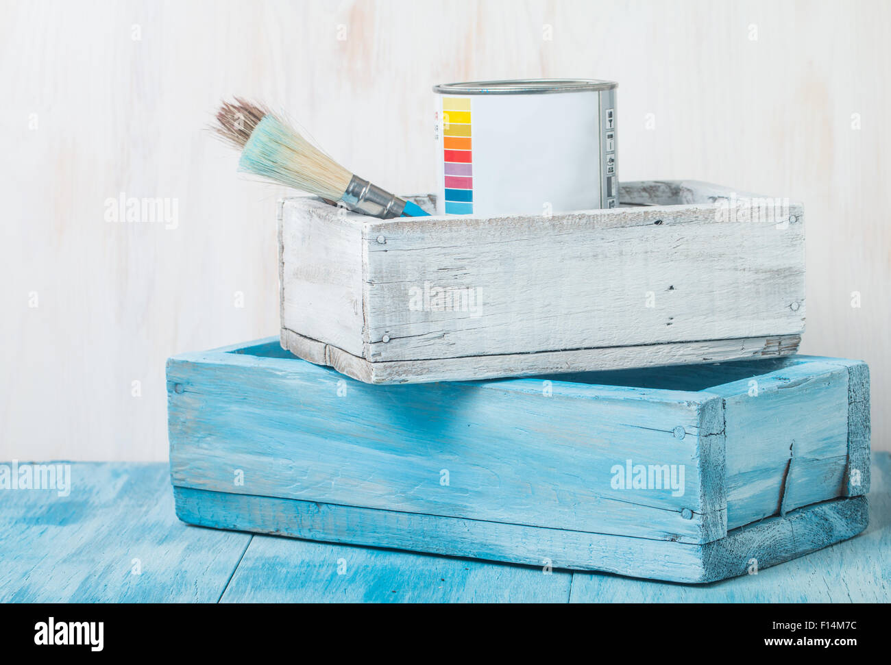 Metal tin can with paint and brush in wooden box Stock Photo - Alamy