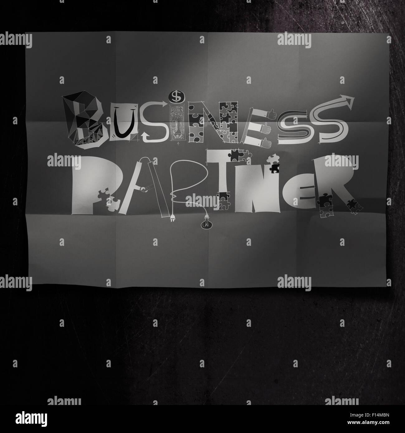 design word BUSINESS PARTNER on dark crumpled paper and texture ...