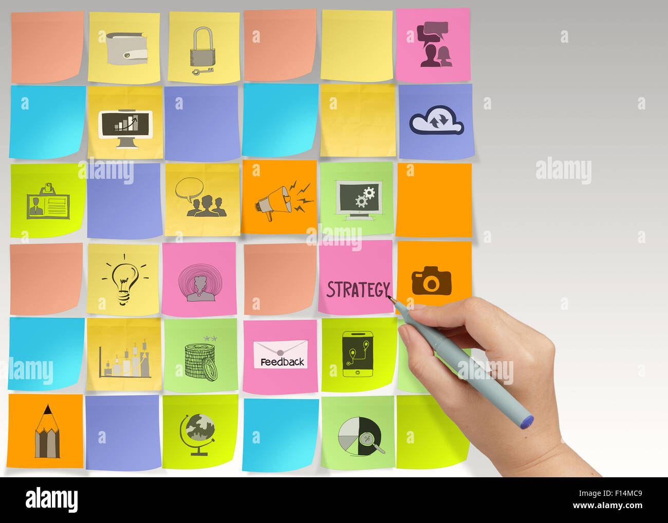 hand drawing STRATEGY words on sticky note as concept Stock Photo - Alamy