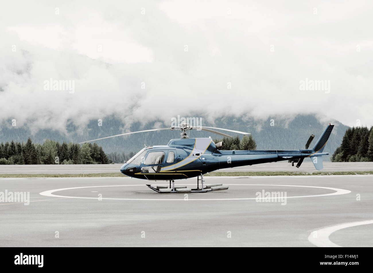 Single-engine Helicopter on platform before launch Stock Photo - Alamy