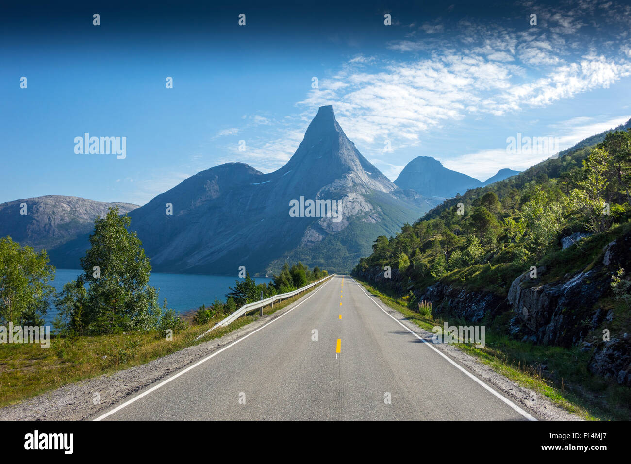Road runs towards Stetind Norway's National Mountain, a rocky peak ...