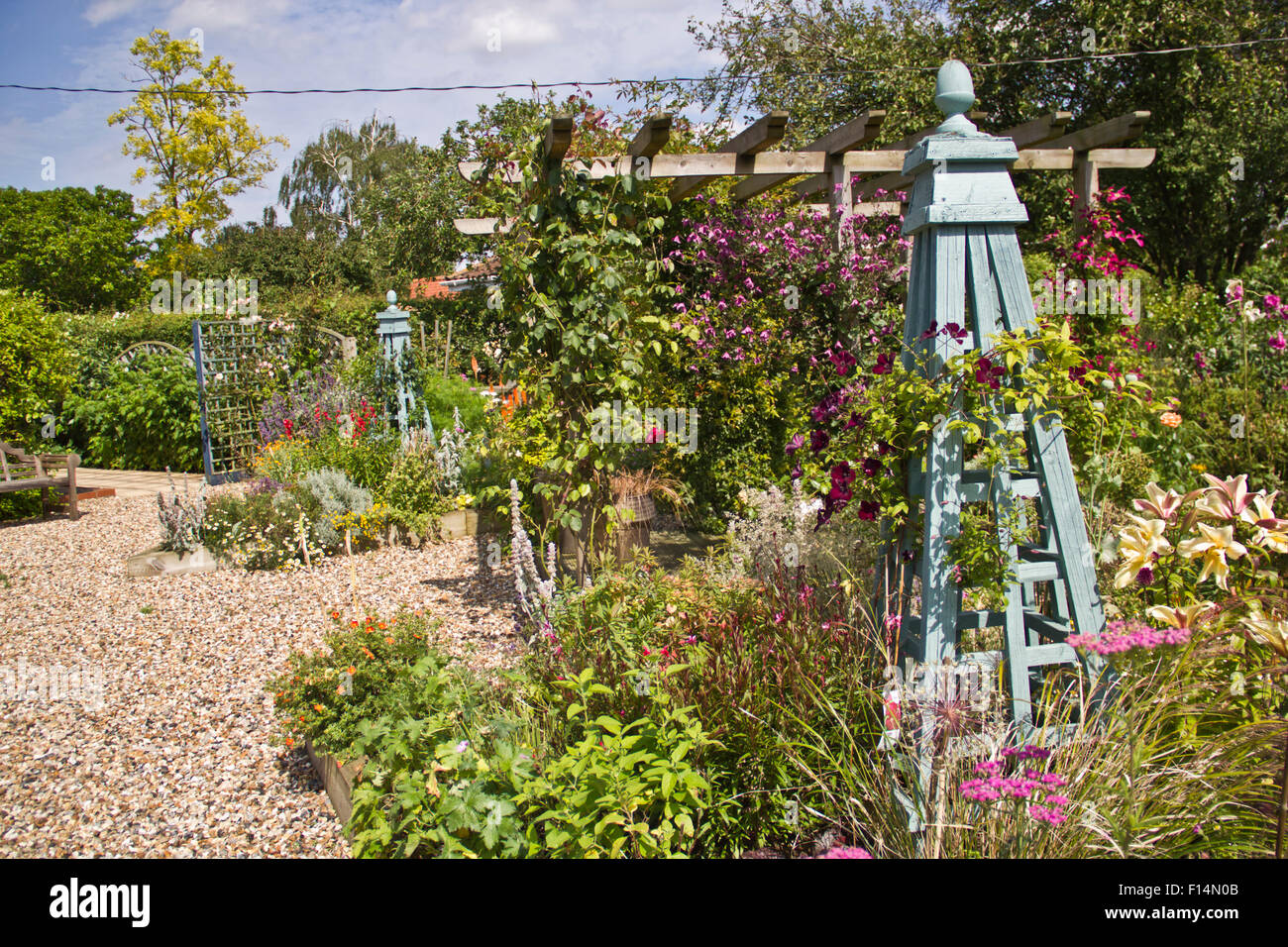 two beautiful handmade hand painted blue obelisks in an english country ...