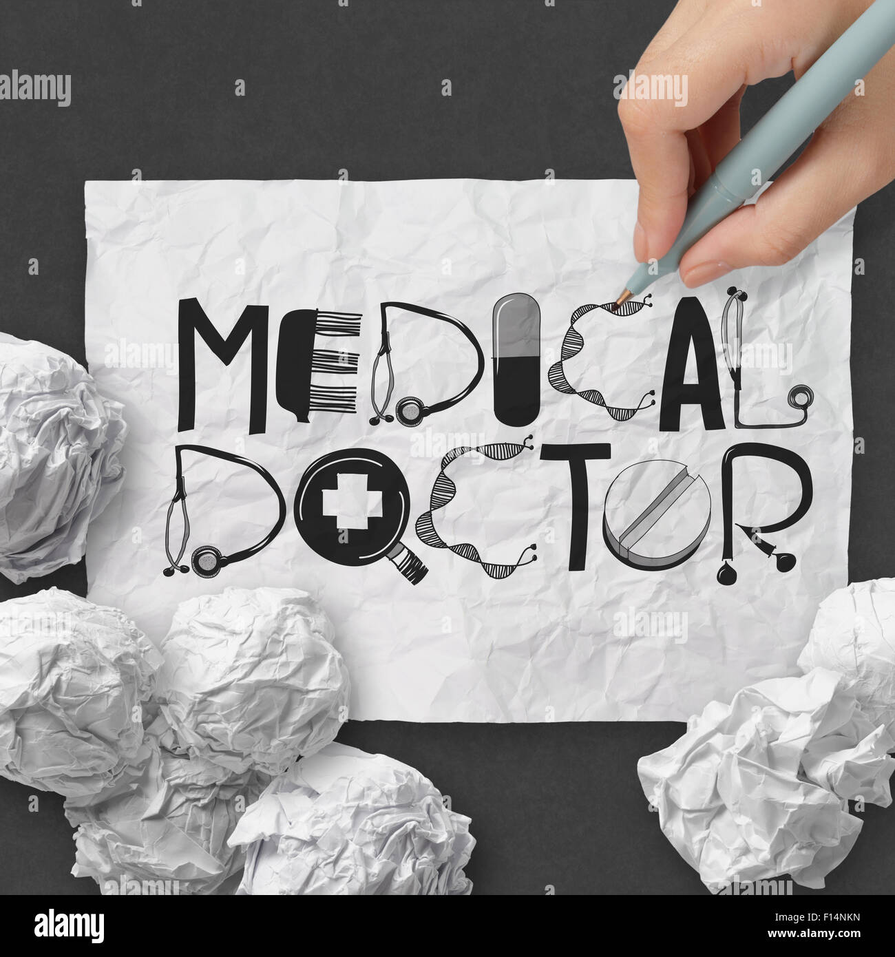hand drawn design word MEDICAL DOCTOR on crumpled paper with as concept ...