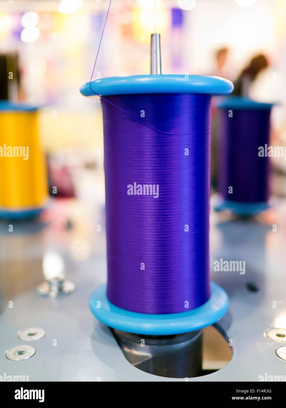 Textile industry - yarn spools on spinning machine in a textile factory ...