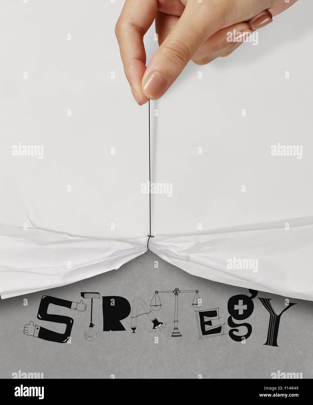 business hand pull rope open wrinkled paper show STRATEGY design text ...