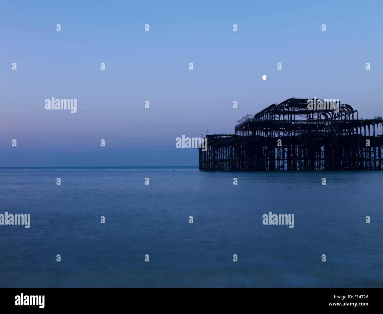 Derelict West Pier, Brighton, moon in clear sky, daybreak Stock Photo ...