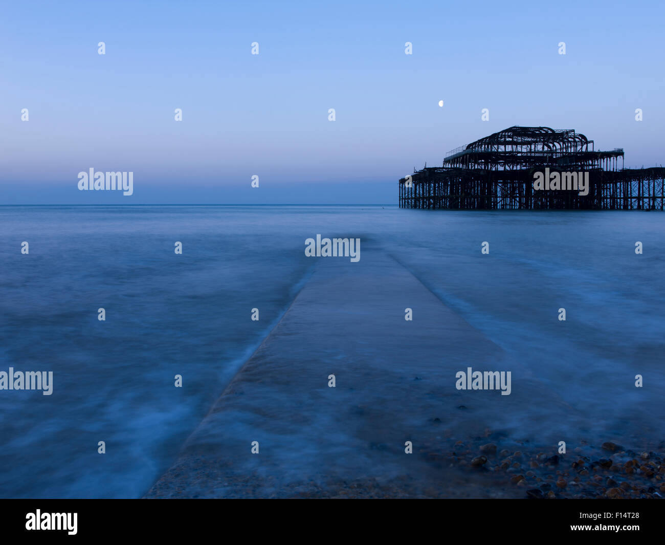 Derelict West Pier, Brighton, submerged groyne, moon Stock Photo - Alamy