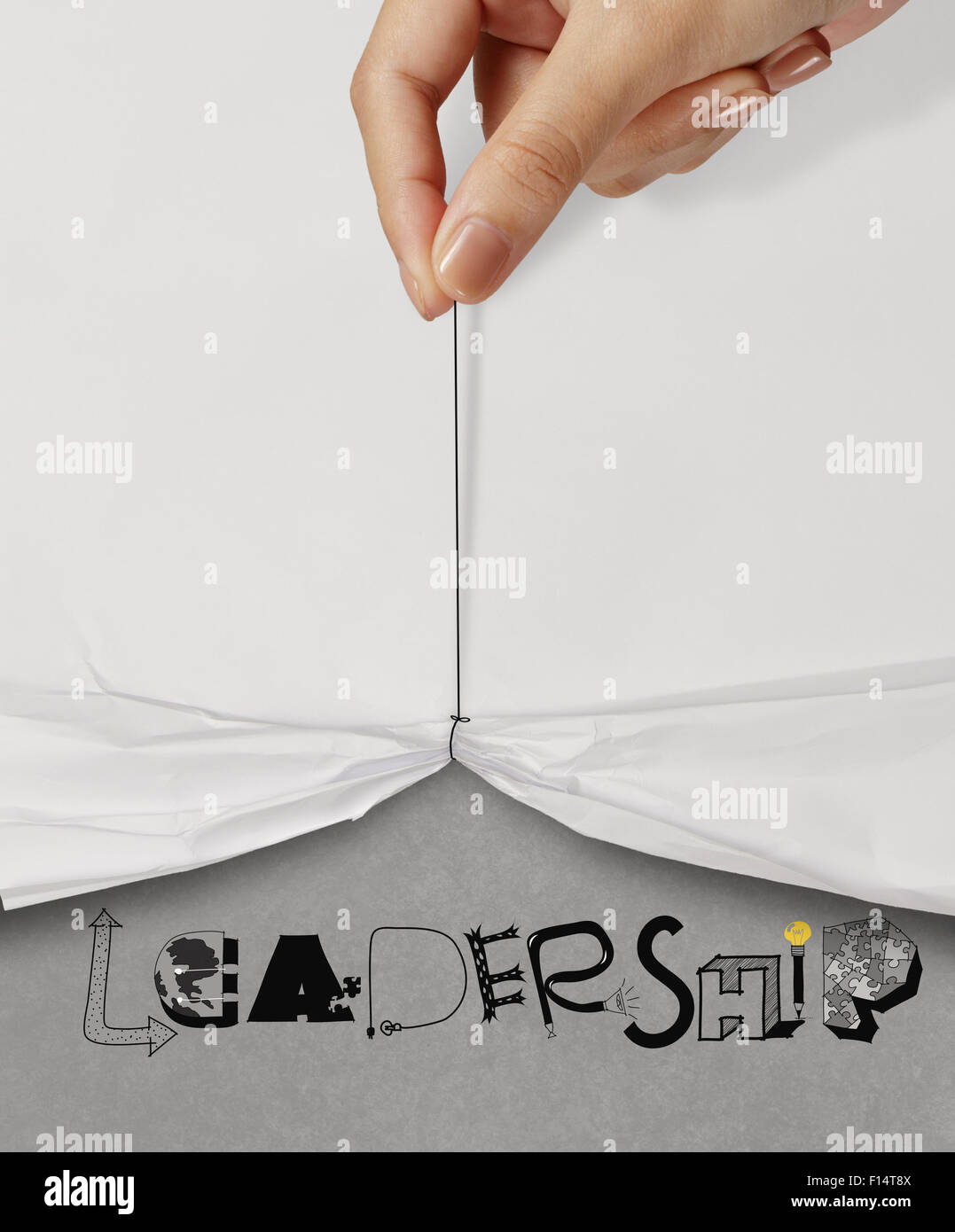 business hand pull rope open wrinkled paper show LEADERSHIP design text ...