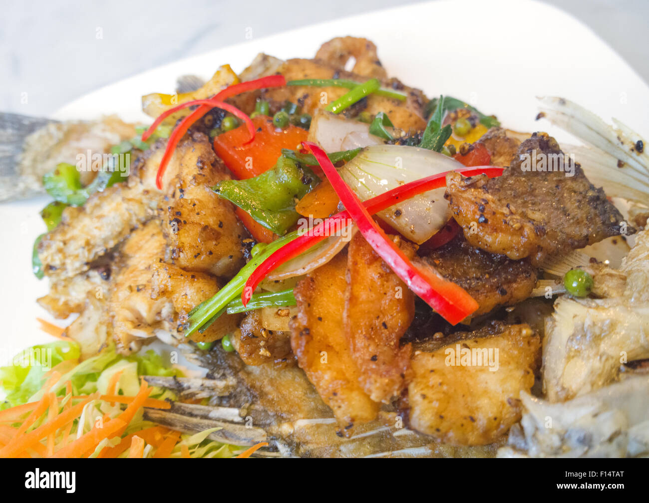 Fried black bass fish hi-res stock photography and images - Alamy