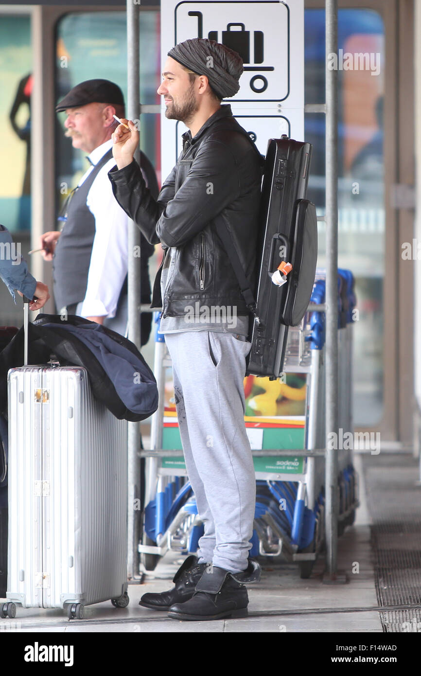 David Garrett smoking a cigarette outside at Tegel airport before ...