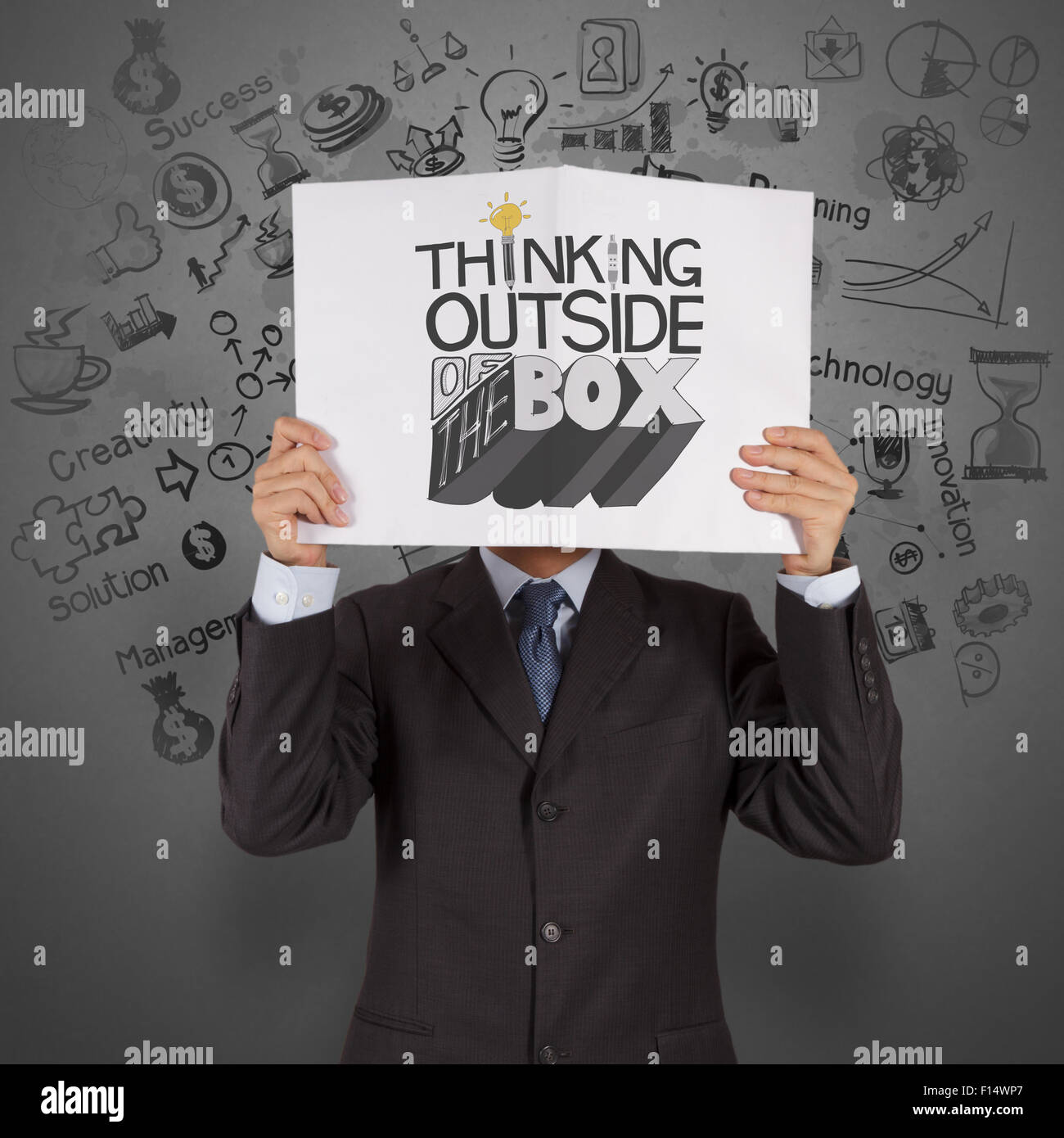 businessman hand showing book of design word THINKING OUTSIDE OF THE ...