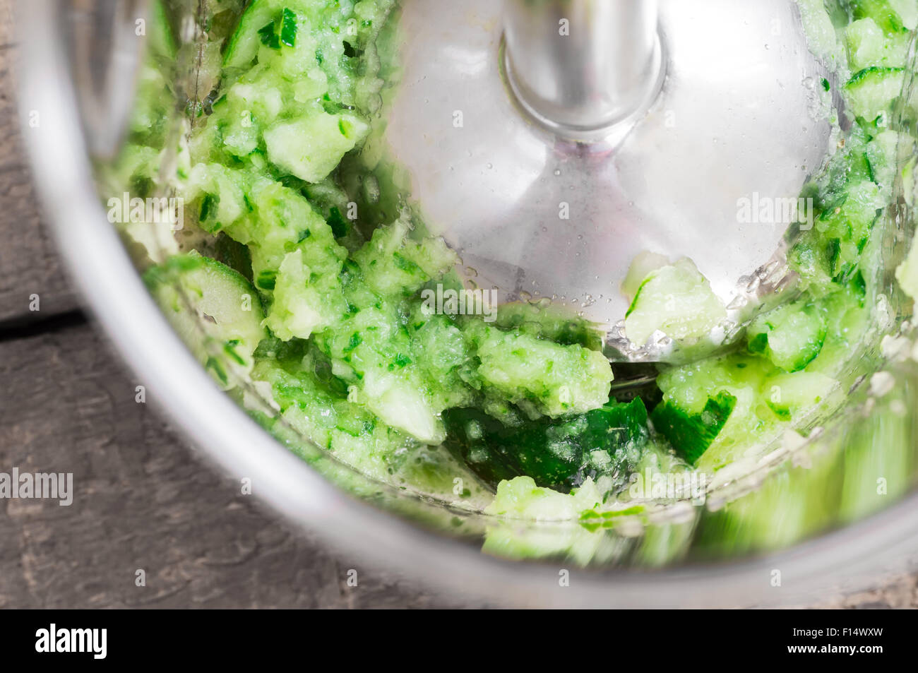 Preparation of cucumber puree hand blender top view Stock Photo - Alamy