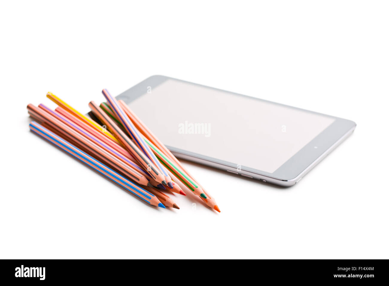 colour pencils and computer tablet on white background Stock Photo - Alamy